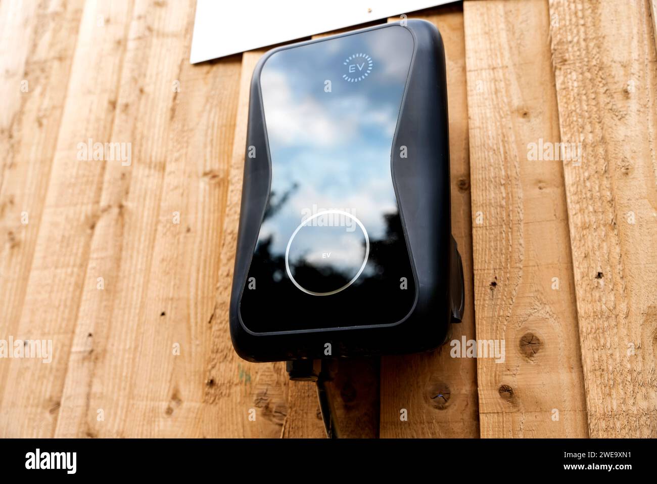 Electric vehicle domestic charging point installed outside of the house ...