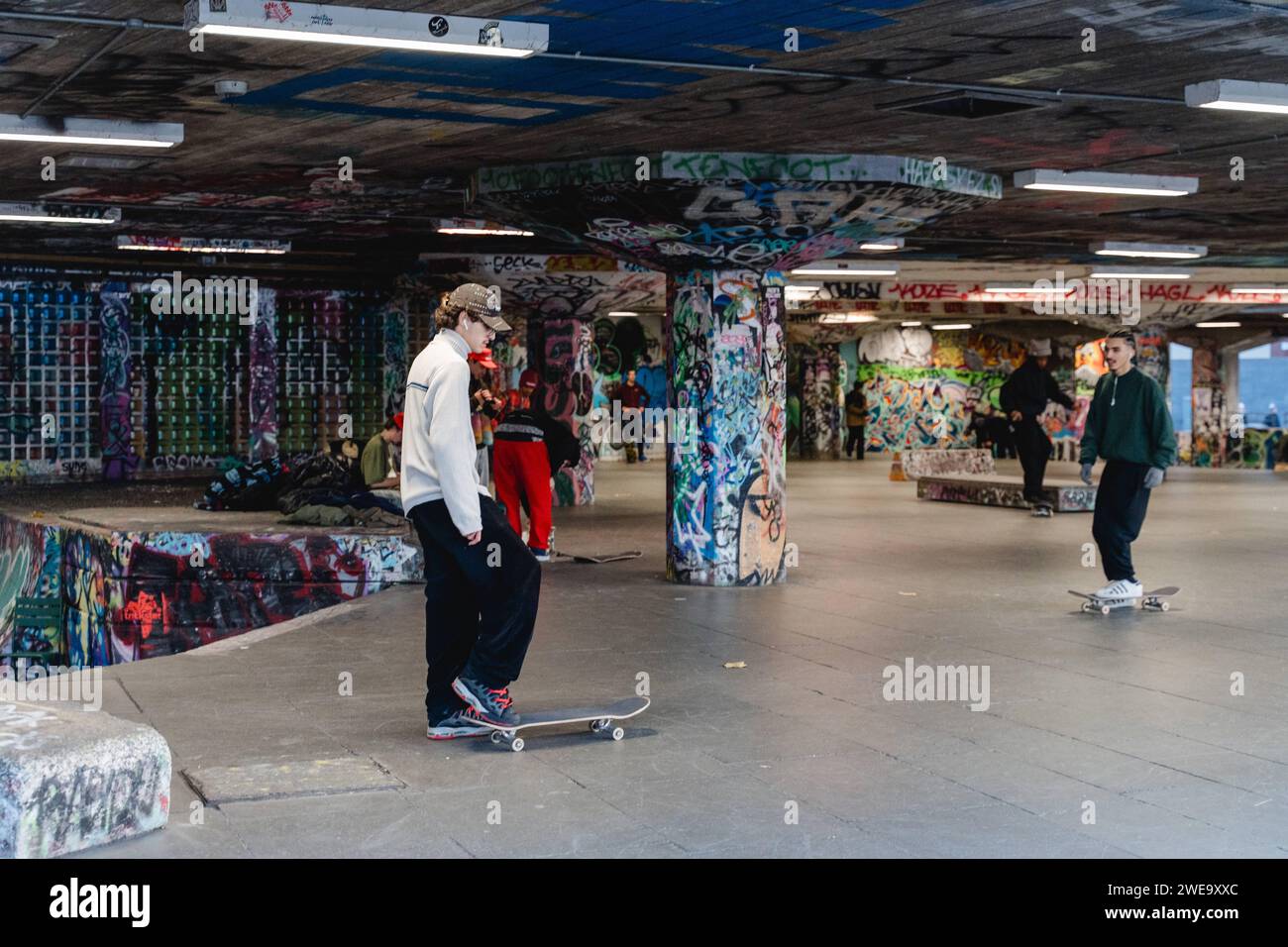 London, England - December 9, 2022: Teenagers skateboarding in a skate ...