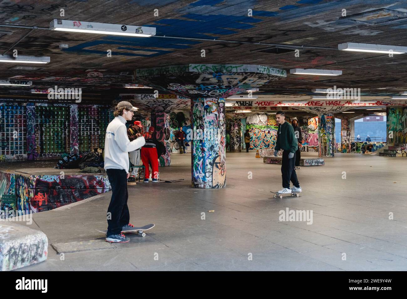 London, England - December 9, 2022: Teenagers skateboarding in a skate ...