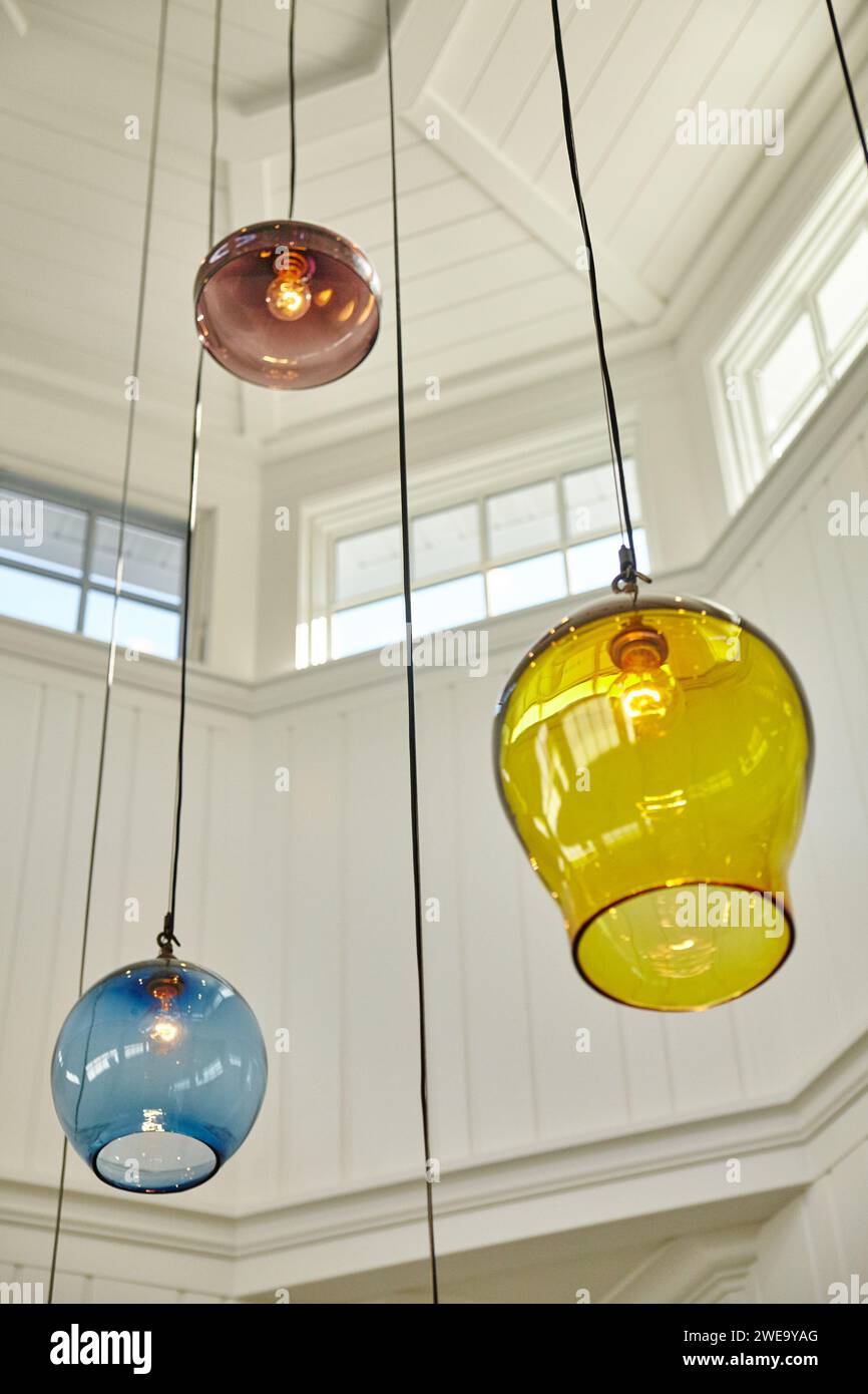 Modern Trio of Colored Glass Pendant Lights in Bright Interior Stock ...