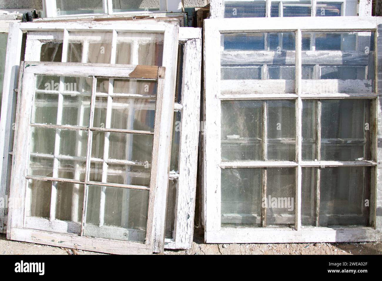 Antique farmhouse windows for sale on a sidewalk Stock Photo - Alamy