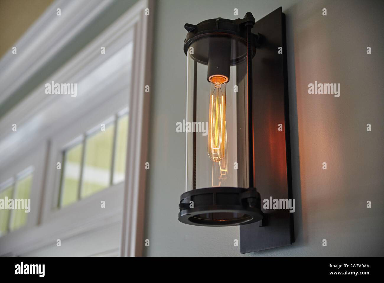 Modern Industrial Wall Light with Edison Bulb and Soft Glow Stock Photo ...