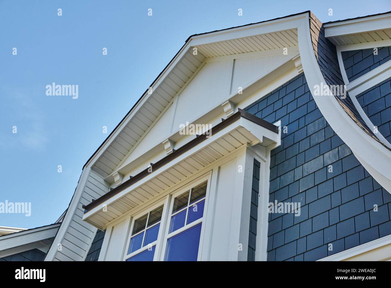 Modern Home Architectural Detail - Roof and Window Against Blue Sky ...
