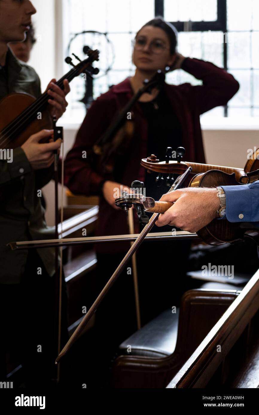 Musicians holding their violins Stock Photo - Alamy