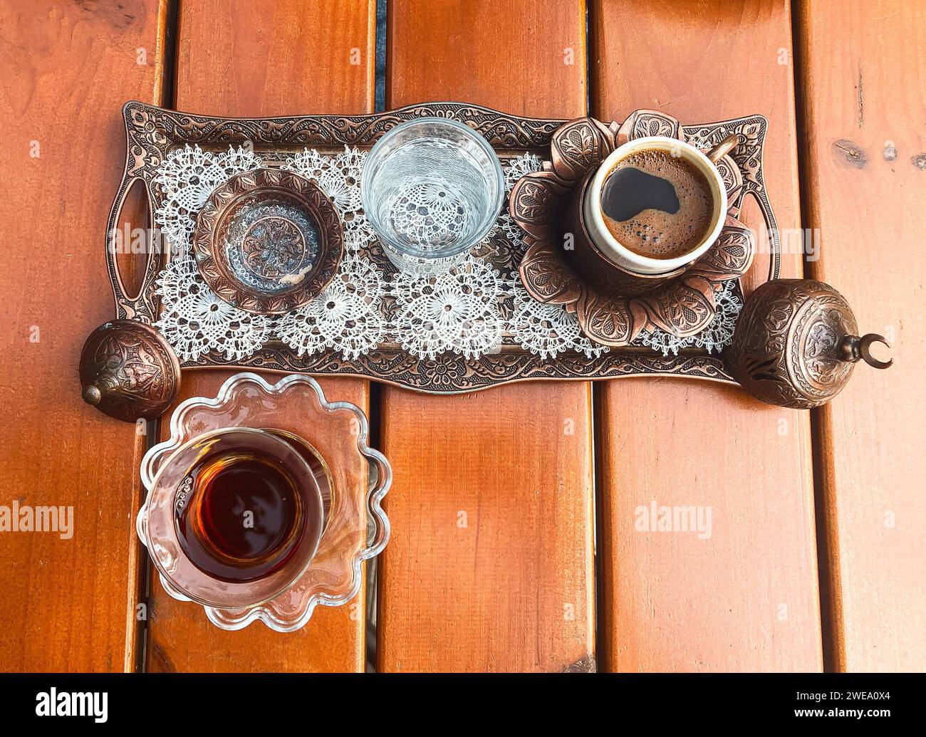 Traditional hot turkish coffee and turkish tea in glass. Retro copper ...