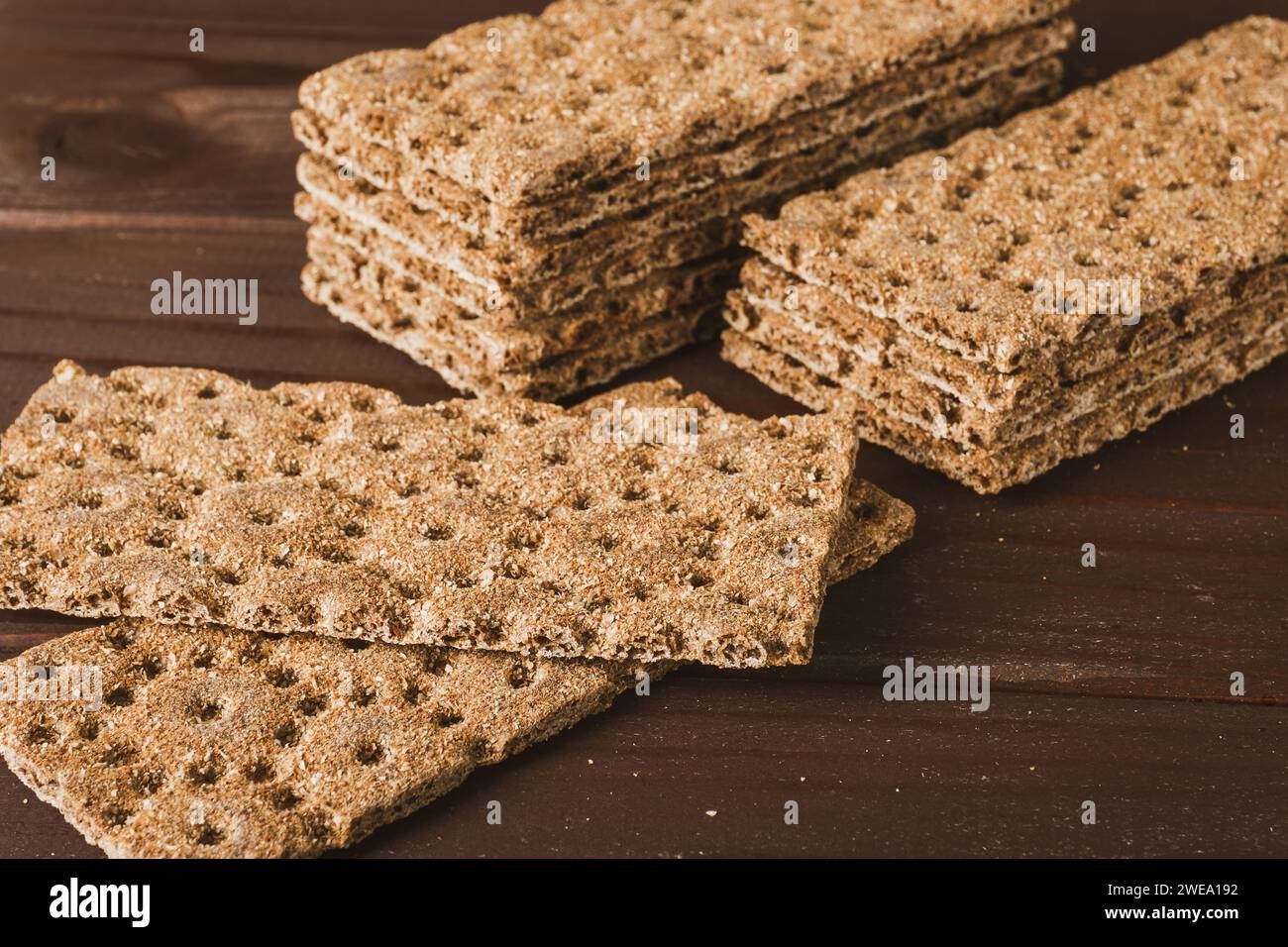 Stack of crispy wheat, rye and corn flatbread crackers. Healthy food ...