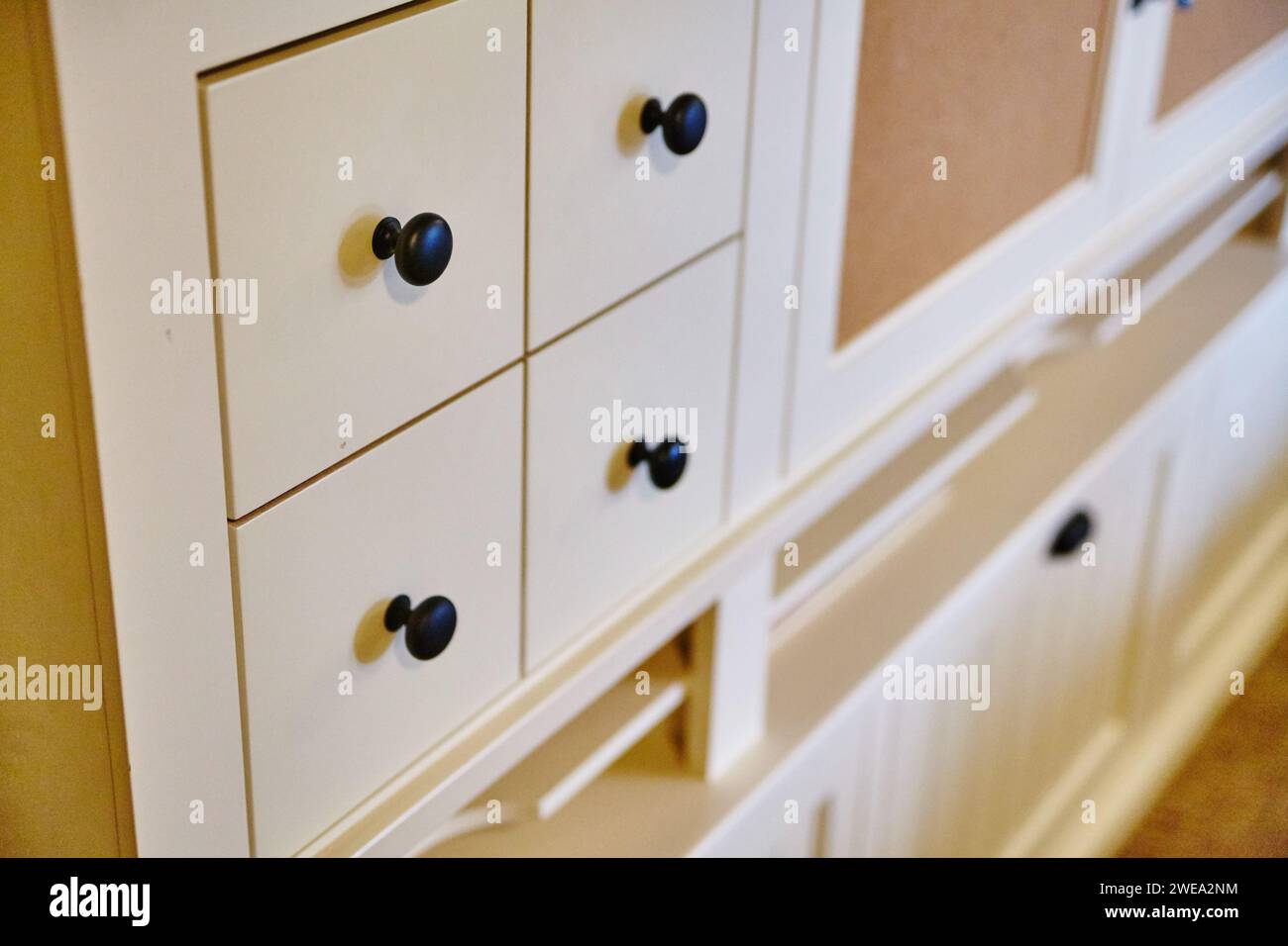 Modern White Wooden Drawers with Black Knobs - Close-Up Perspective ...