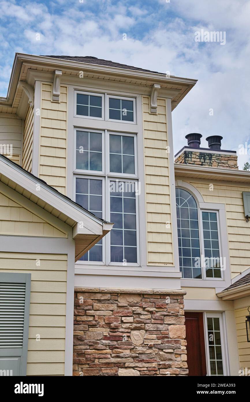 Modern Suburban Home with Stone Cladding and Tall Windows Stock Photo ...