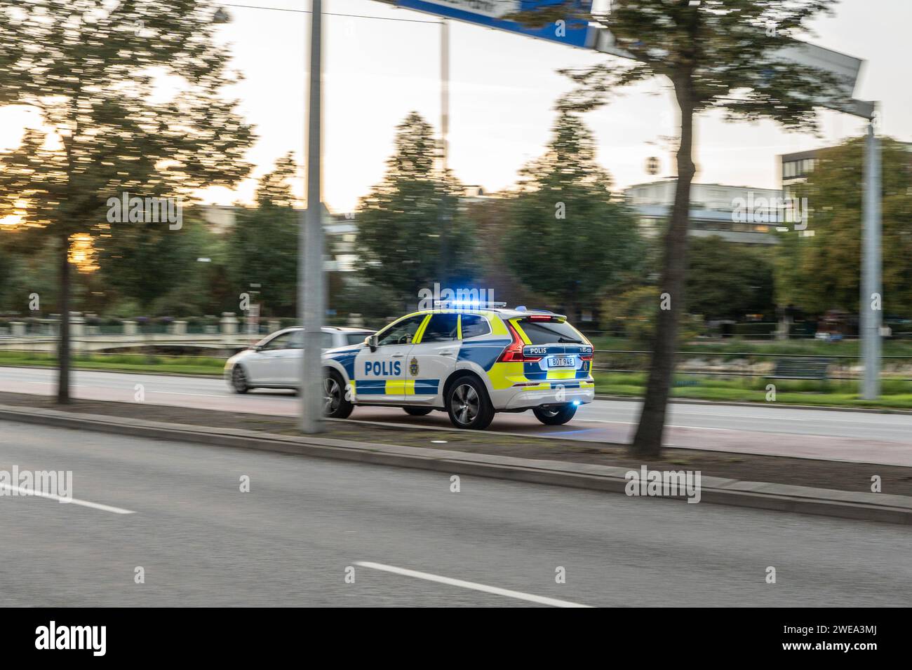 Police car driving hi-res stock photography and images - Alamy