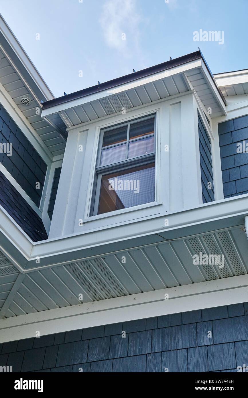 Bay Window Detail on Blue and Gray Sided Home, Upward View Stock Photo ...