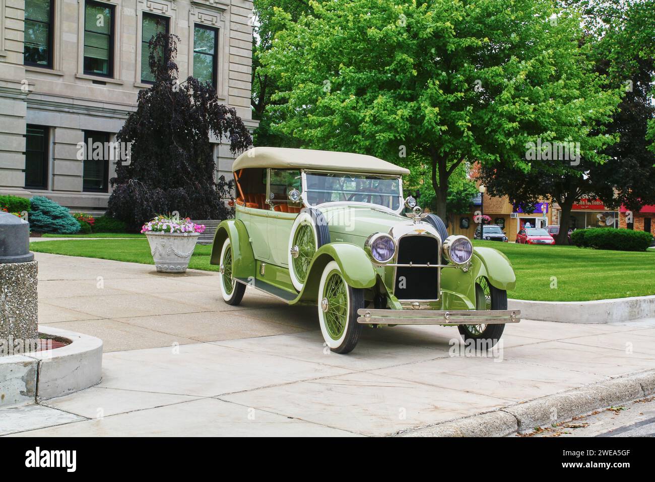 Vintage Green Convertible at Classical Building, Eye-Level View Stock ...