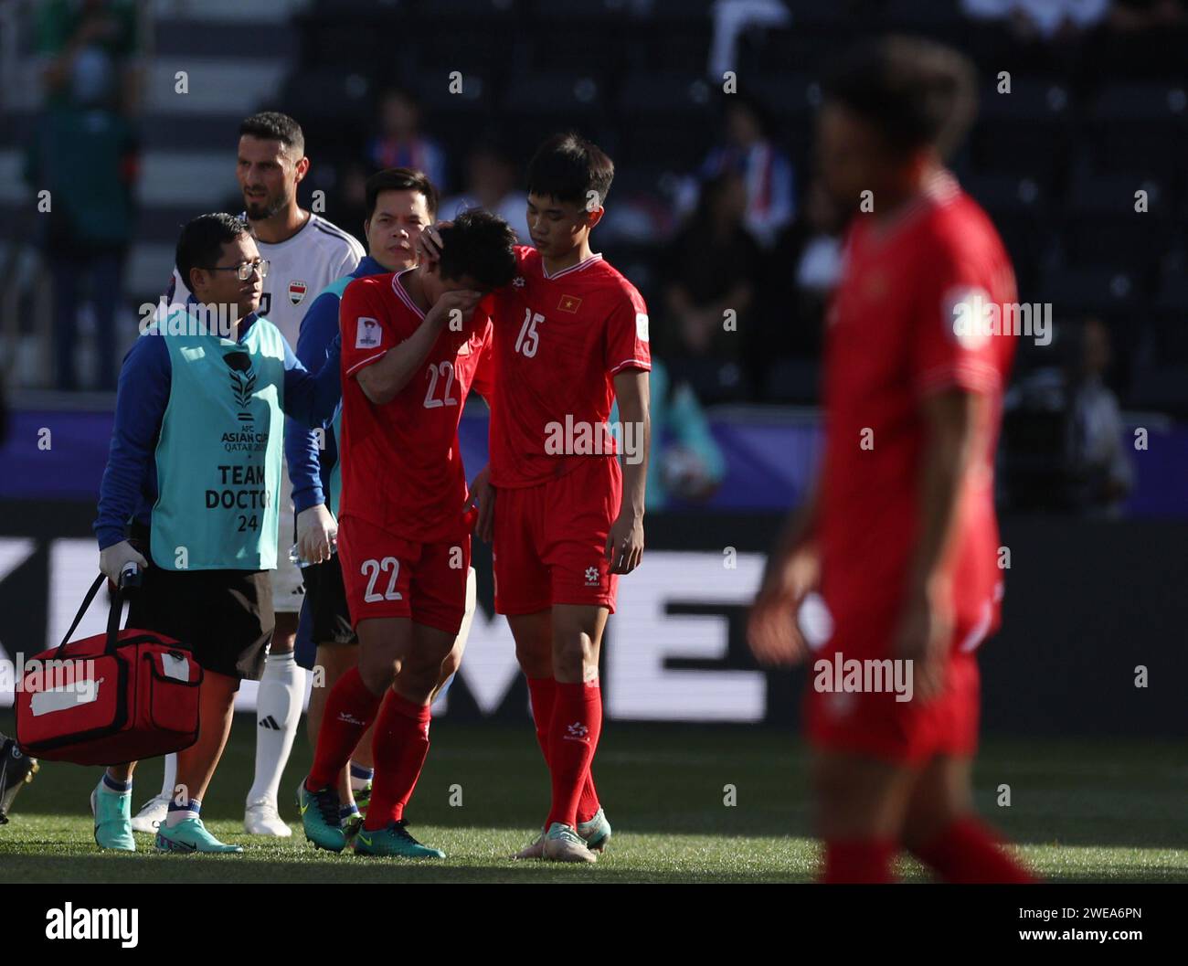 Doha. 24th Jan, 2024. Khuat Van Khang (4th L) of vietnam is escorted ...
