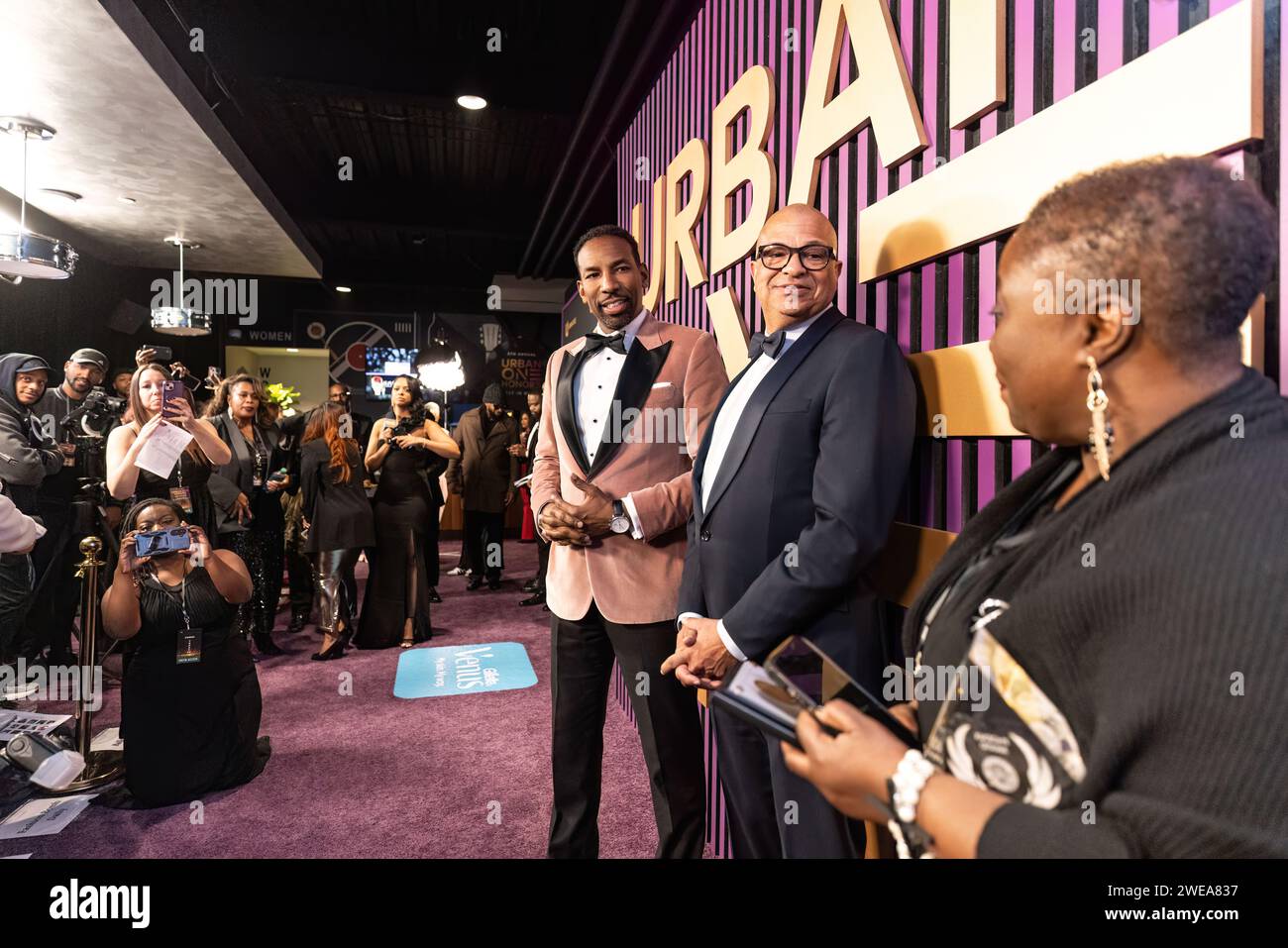 Mayor of Atlanta Andre Dickens (L) presents TV ONE CEO Alfred C ...