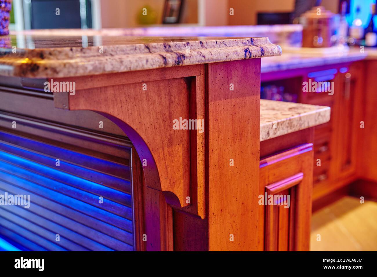 Luxurious Kitchen Island Design with Blue Accent Lighting Stock Photo ...
