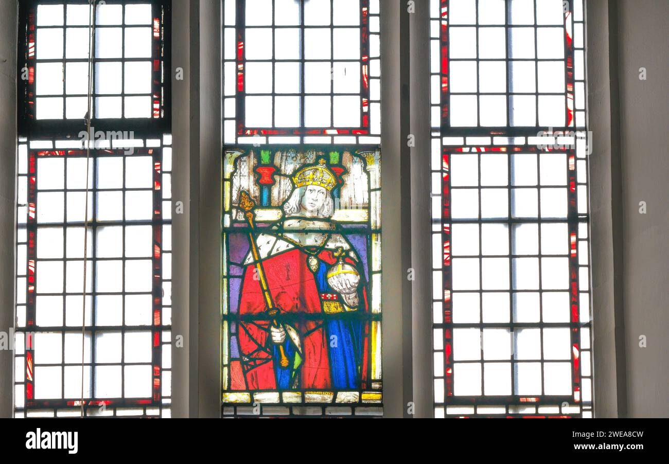Tudor stained glass window of a king with crown, orb and sceptre, in ...