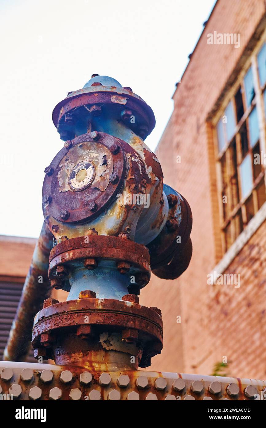 Vintage Rusting Fire Hydrant Against Brick Building Stock Photo - Alamy