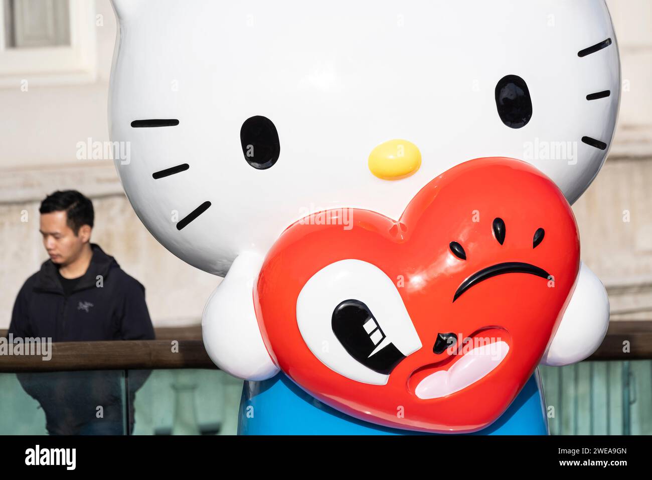 London, UK. 24 January 2024. A man passes 'Hello, Love', 2023, a ...