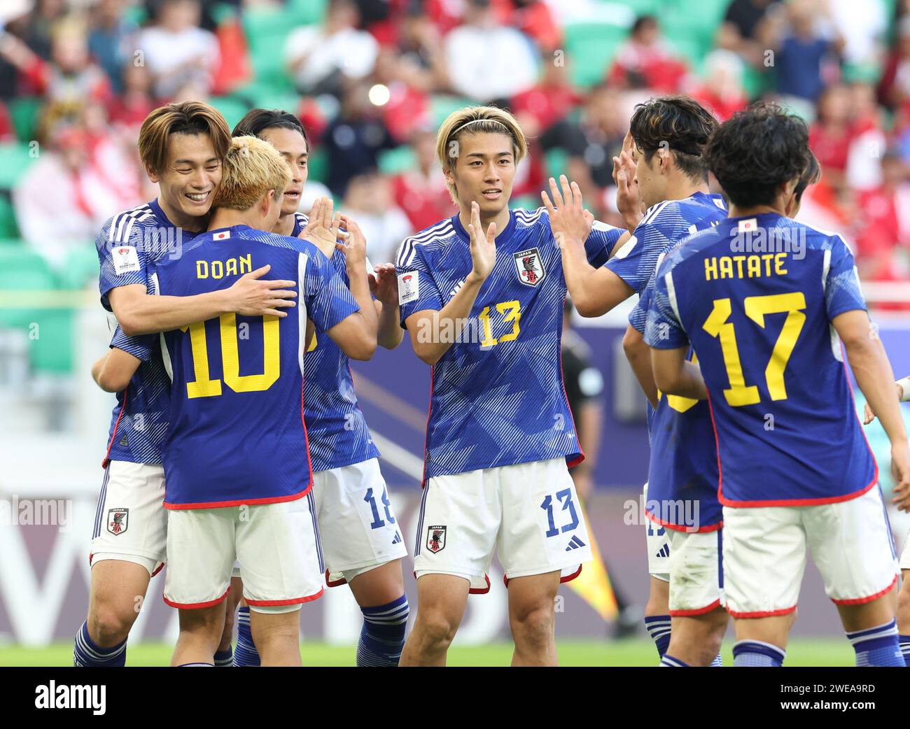 Doha. 24th Jan, 2024. Players of Japan celebrate scoring during the ...