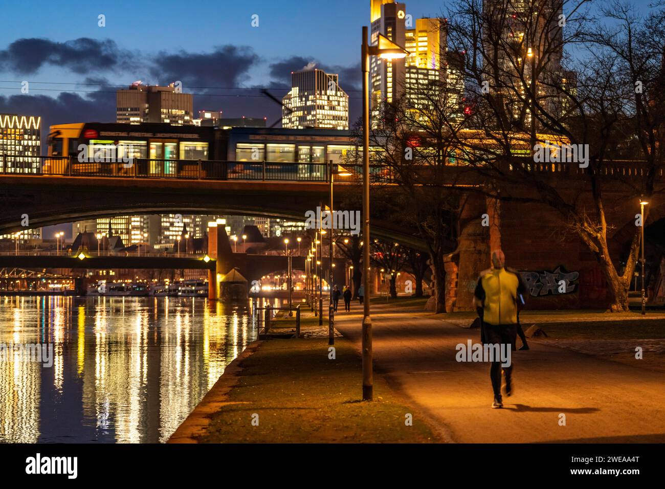 Skyline of the city center of Frankfurt am Main, jogger on the sidewalk ...