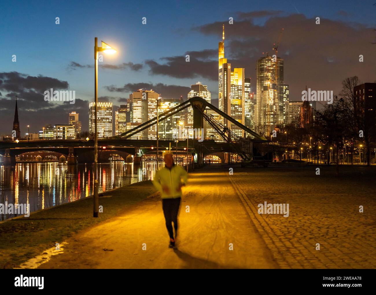 Skyline of downtown Frankfurt am Main, joggers on the sidewalk ...