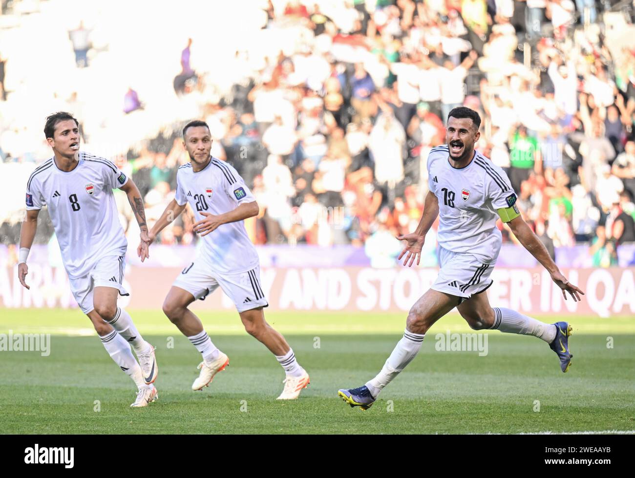 Doha. 24th Jan, 2024. Aymen Hussein (R) of Iraq celebrates scoring ...