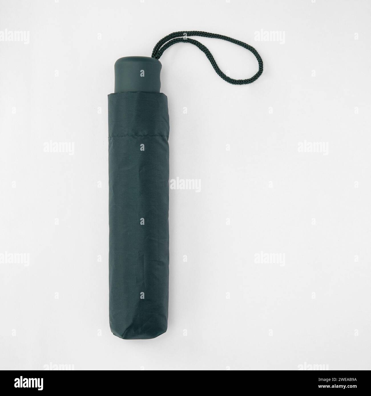 Folded cover umbrella isolated on white background with clipping path ...