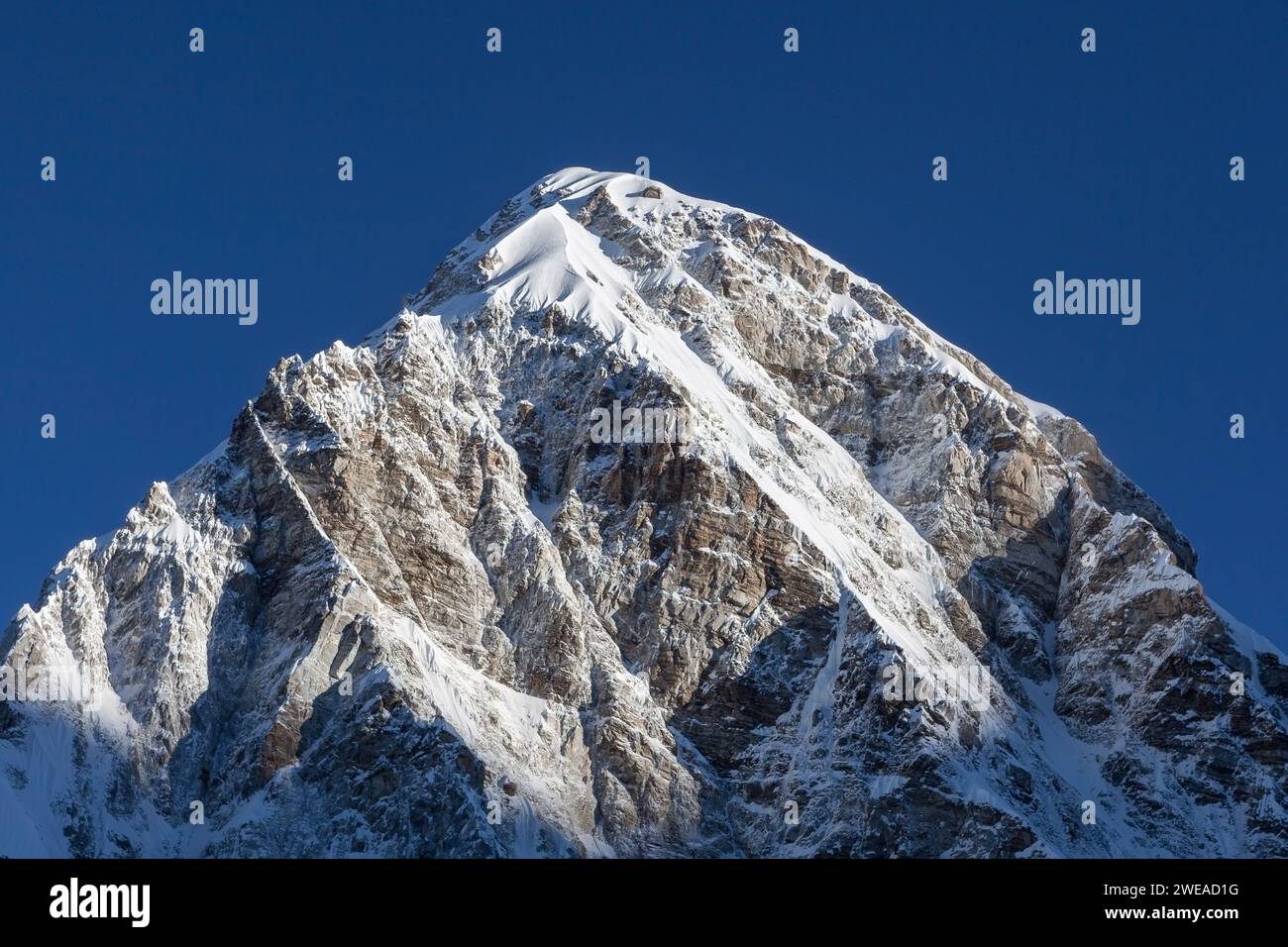 Pumori mountain peak on the famous Everest Base Camp trek in Himalayas ...
