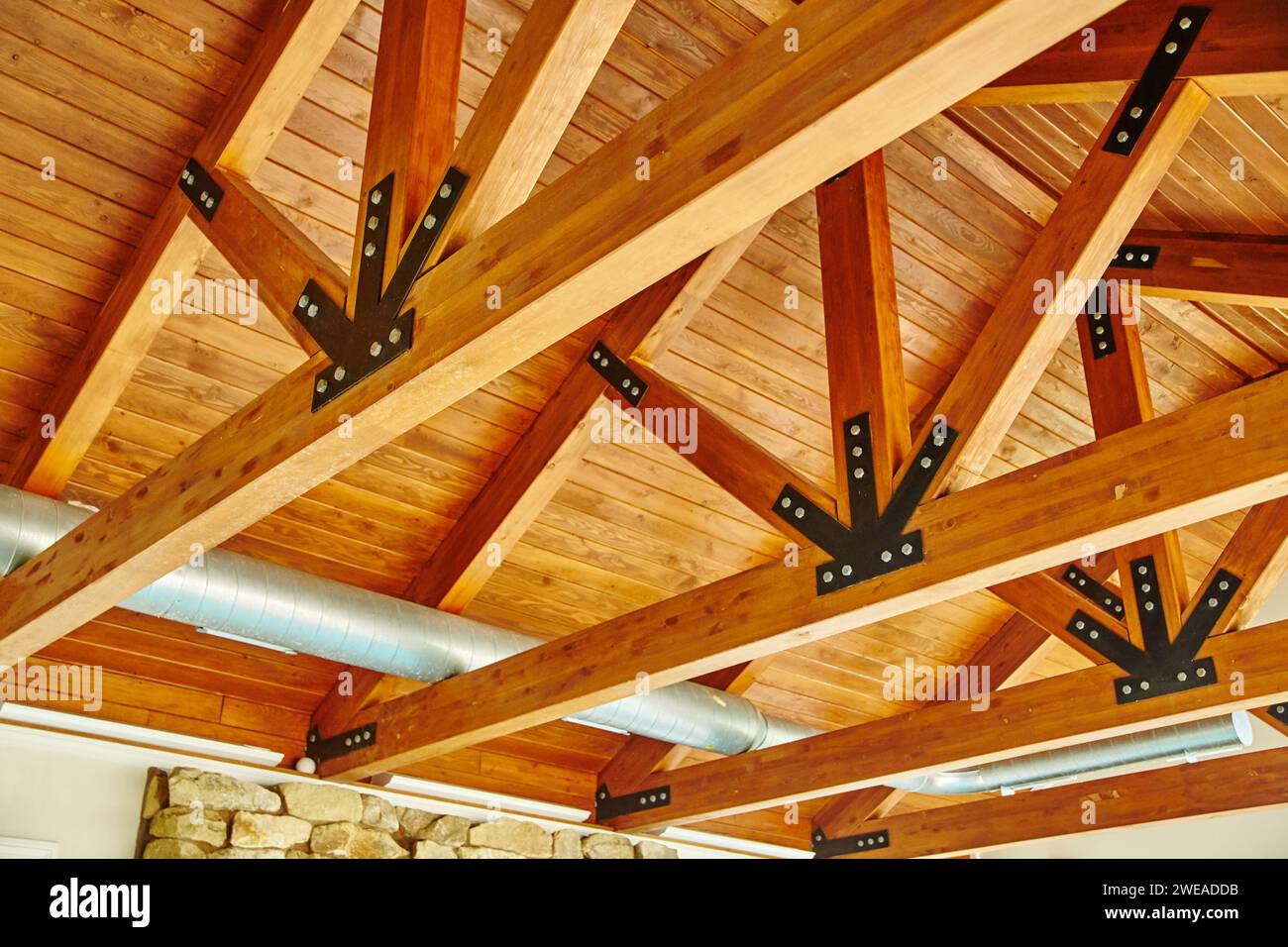 Rustic Wooden Beam Ceiling with Metal Brackets and Air Duct Stock Photo ...