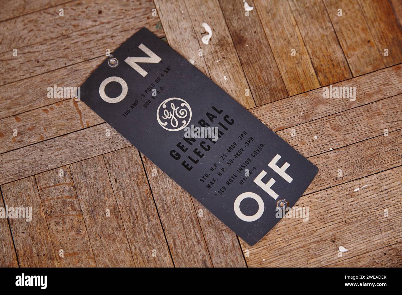 Vintage Electrical ON OFF Nameplate on Wooden Texture Stock Photo - Alamy