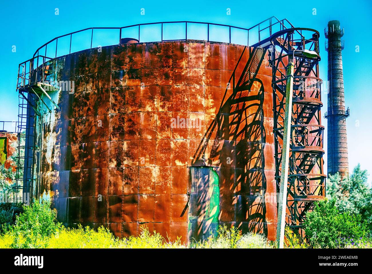 Old rusty oil tanks (fuel reservoir, oil barrel). Evidence of economic ...