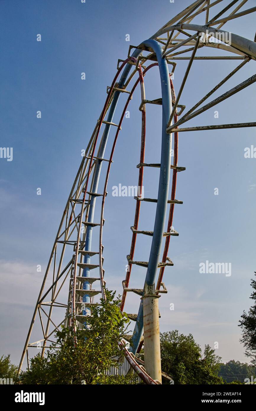 Abandoned White and Red Roller Coaster with Blue Sky Ground Up View ...
