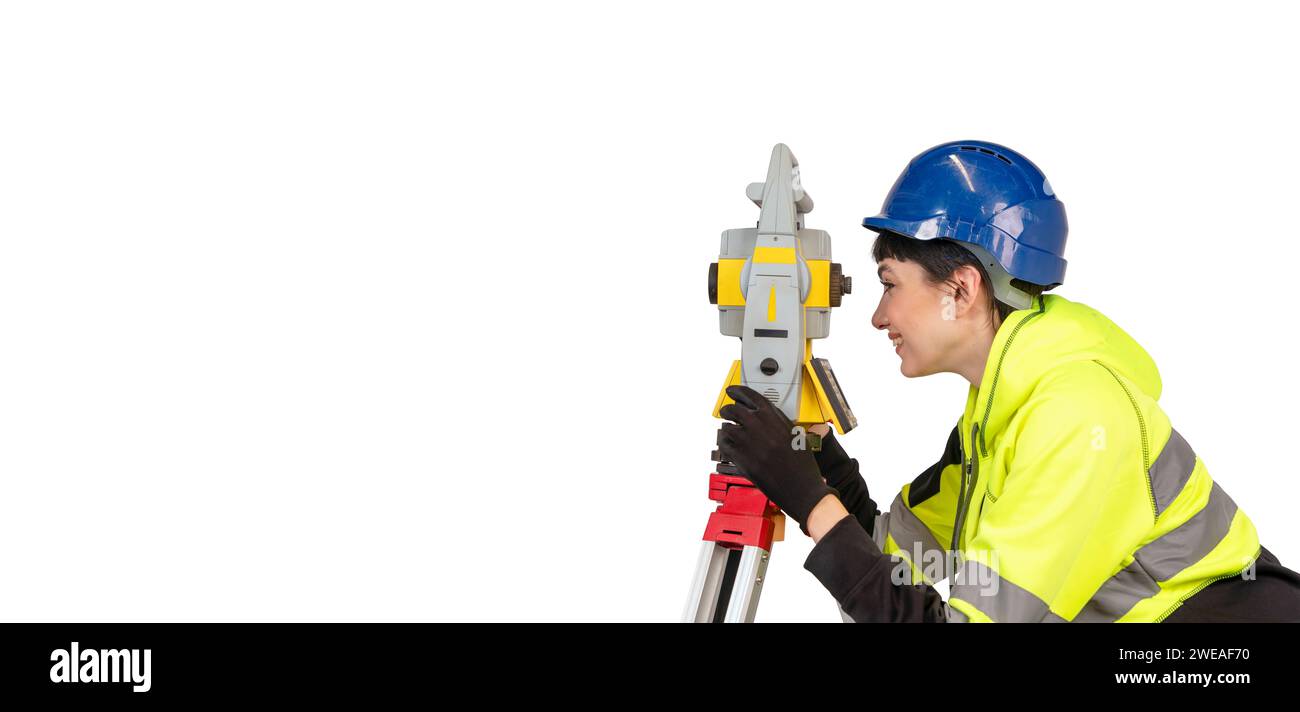 Woman in blue hard hat and yellow protective clothes land surveyor ...