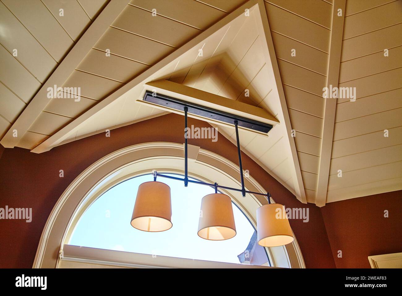 Elegant Interior with Arched Window and Pendant Lights, Low Angle View ...