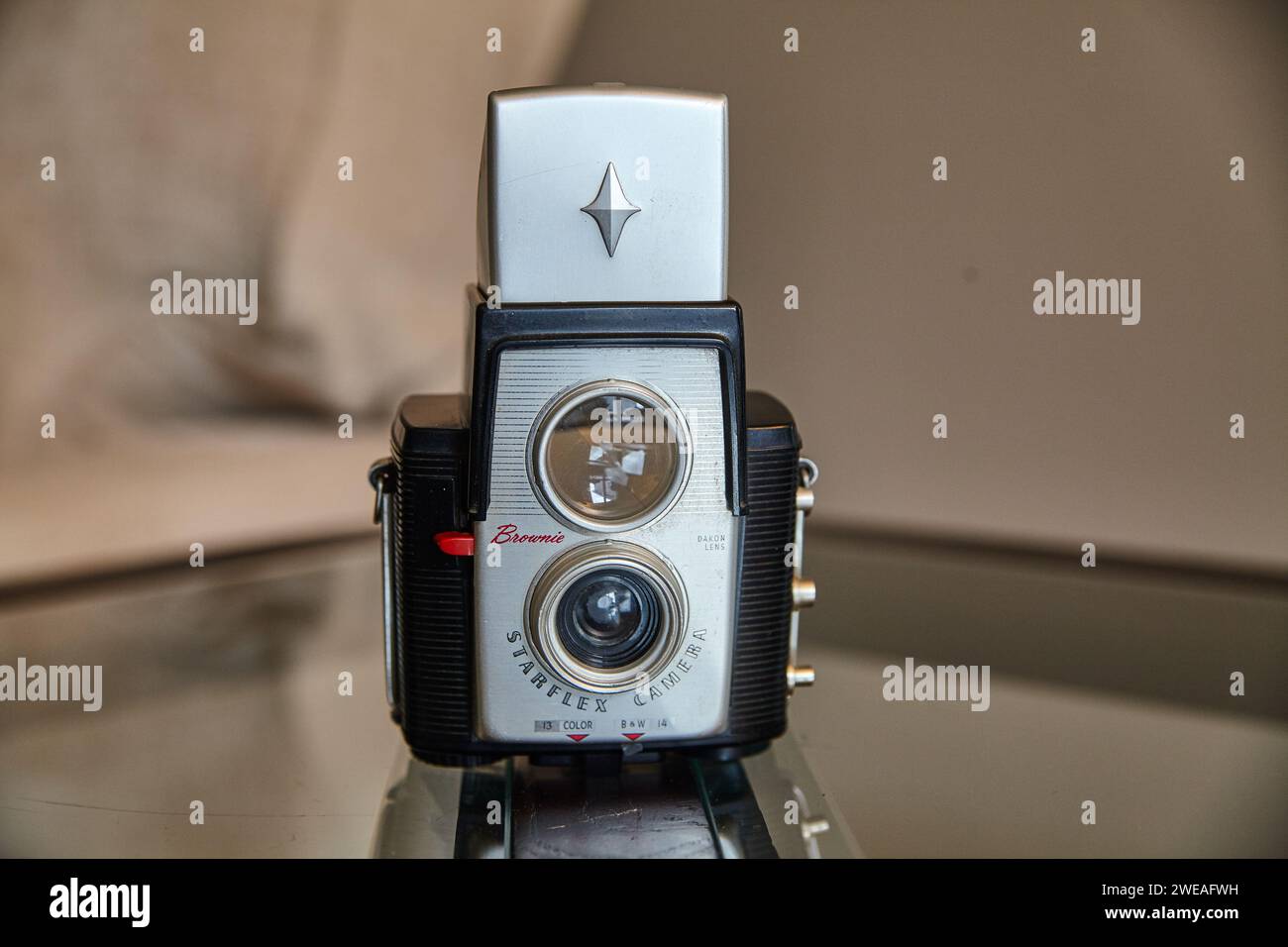 Vintage Twin-Lens Reflex Camera on Reflective Surface, Eye-Level View ...