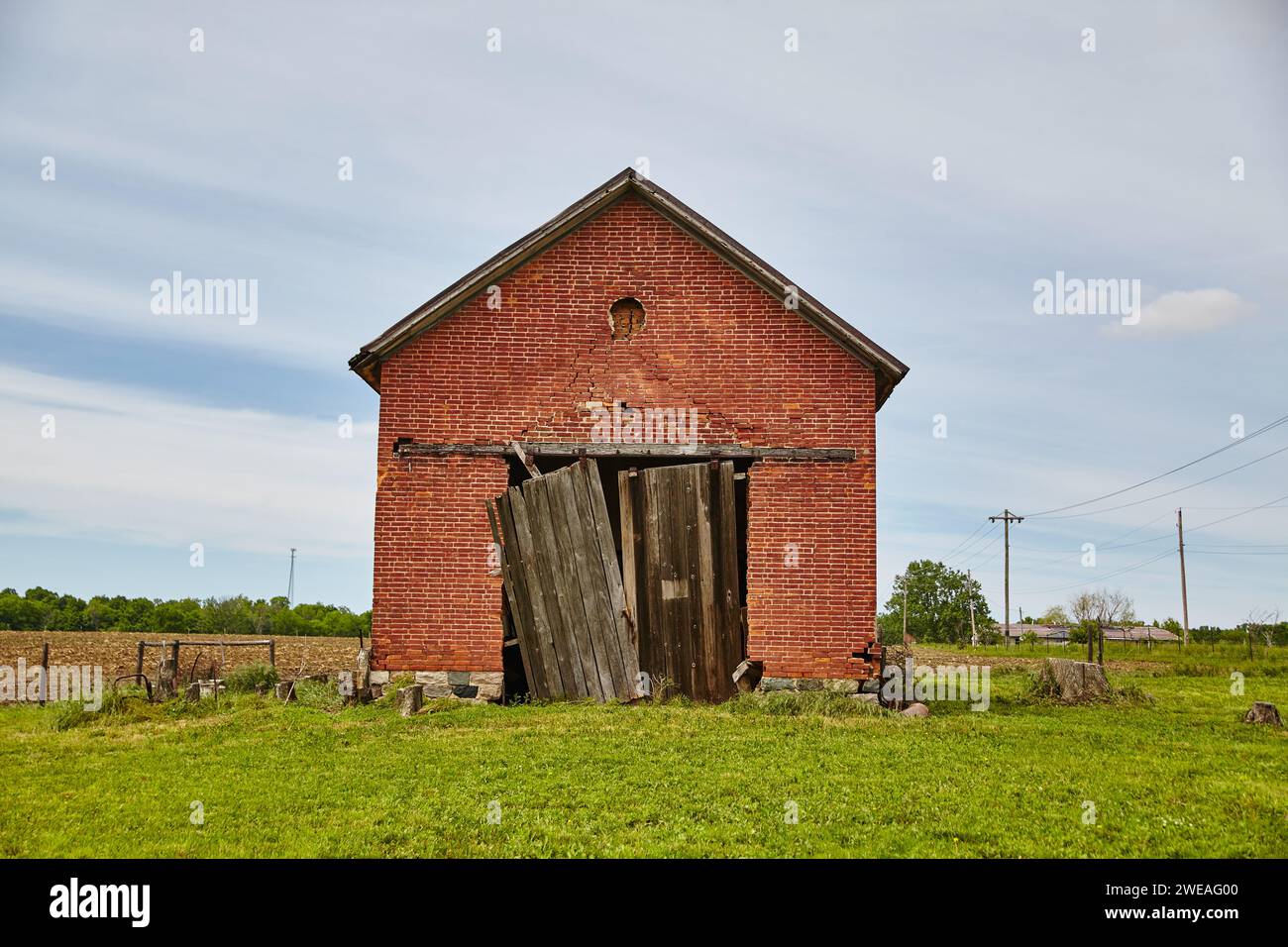 Weathered Red Brick Barn in Rural Landscape with Blue Sky Stock Photo ...