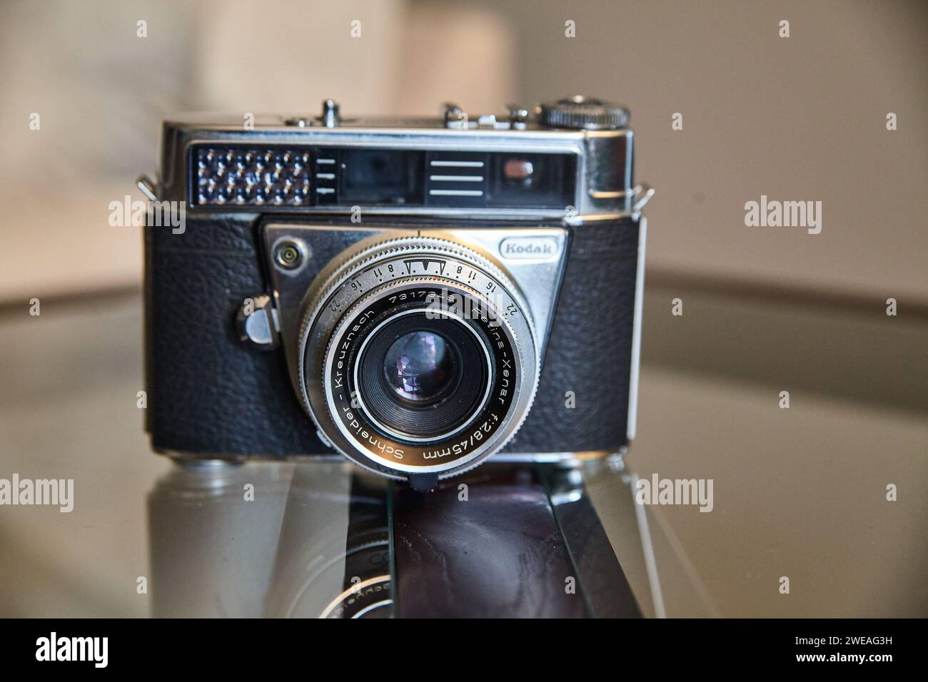Vintage Kodak Film Camera on Reflective Surface Stock Photo - Alamy