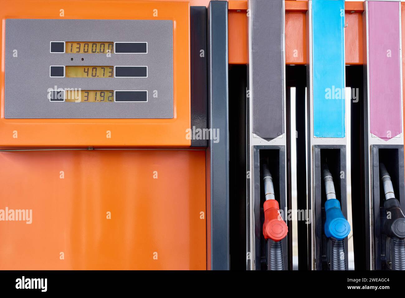 Closeup background image of nozzles in row on orange fuel pump in ...