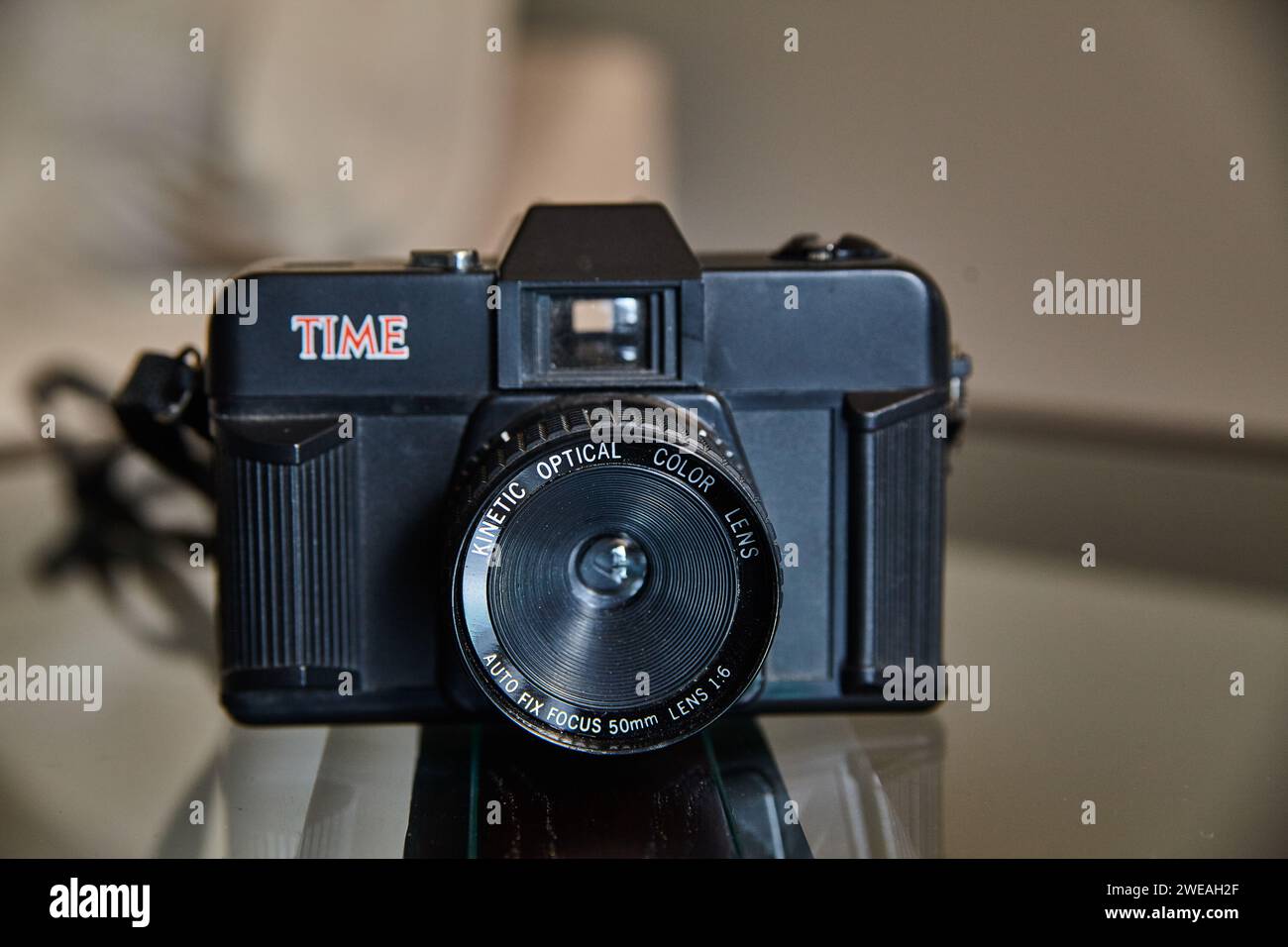 Vintage Black Film Camera with Kinetic Lens on Reflective Surface Stock ...