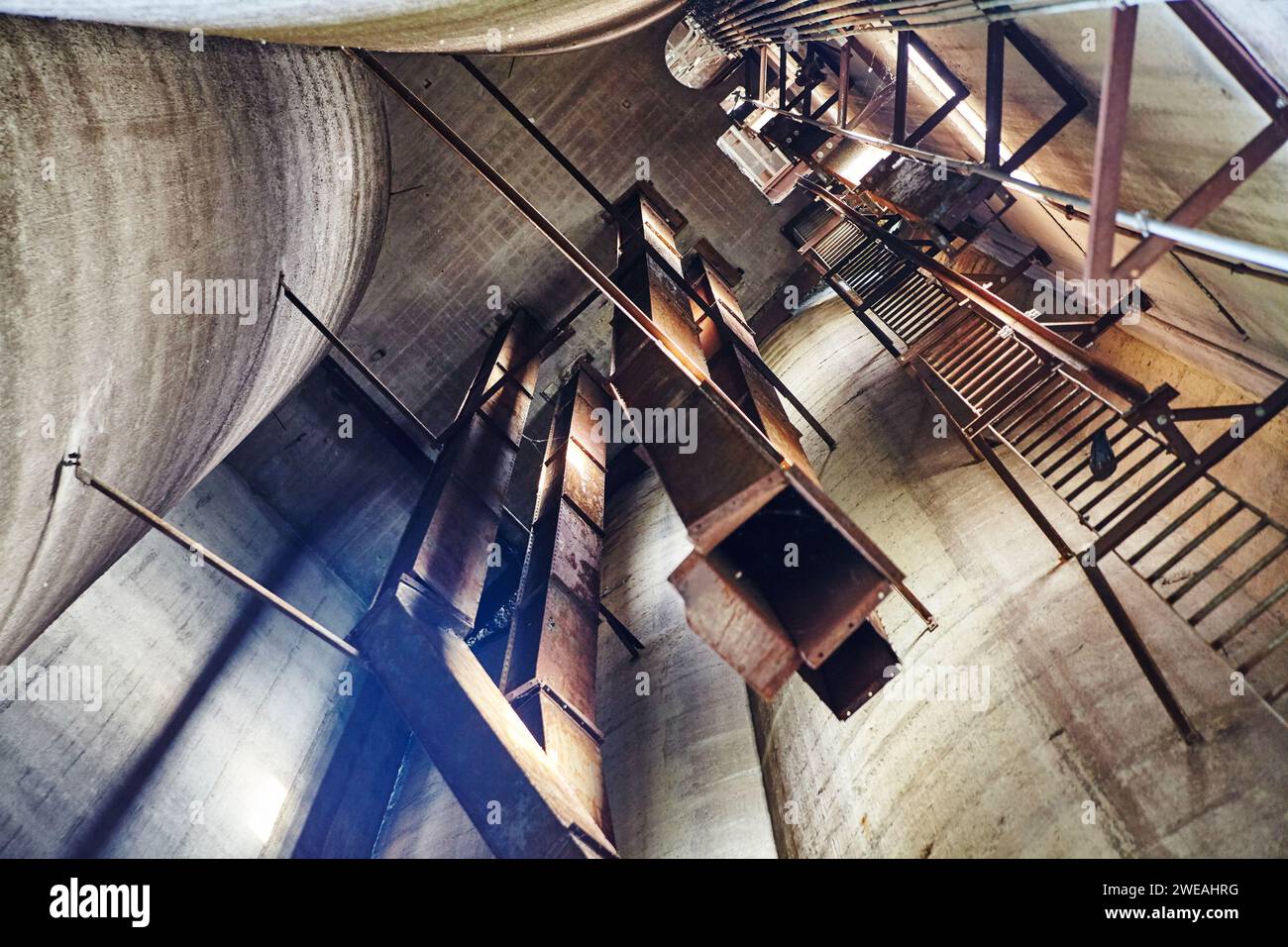 Abandoned Industrial Silo Interior with Metal Staircase, Dramatic ...