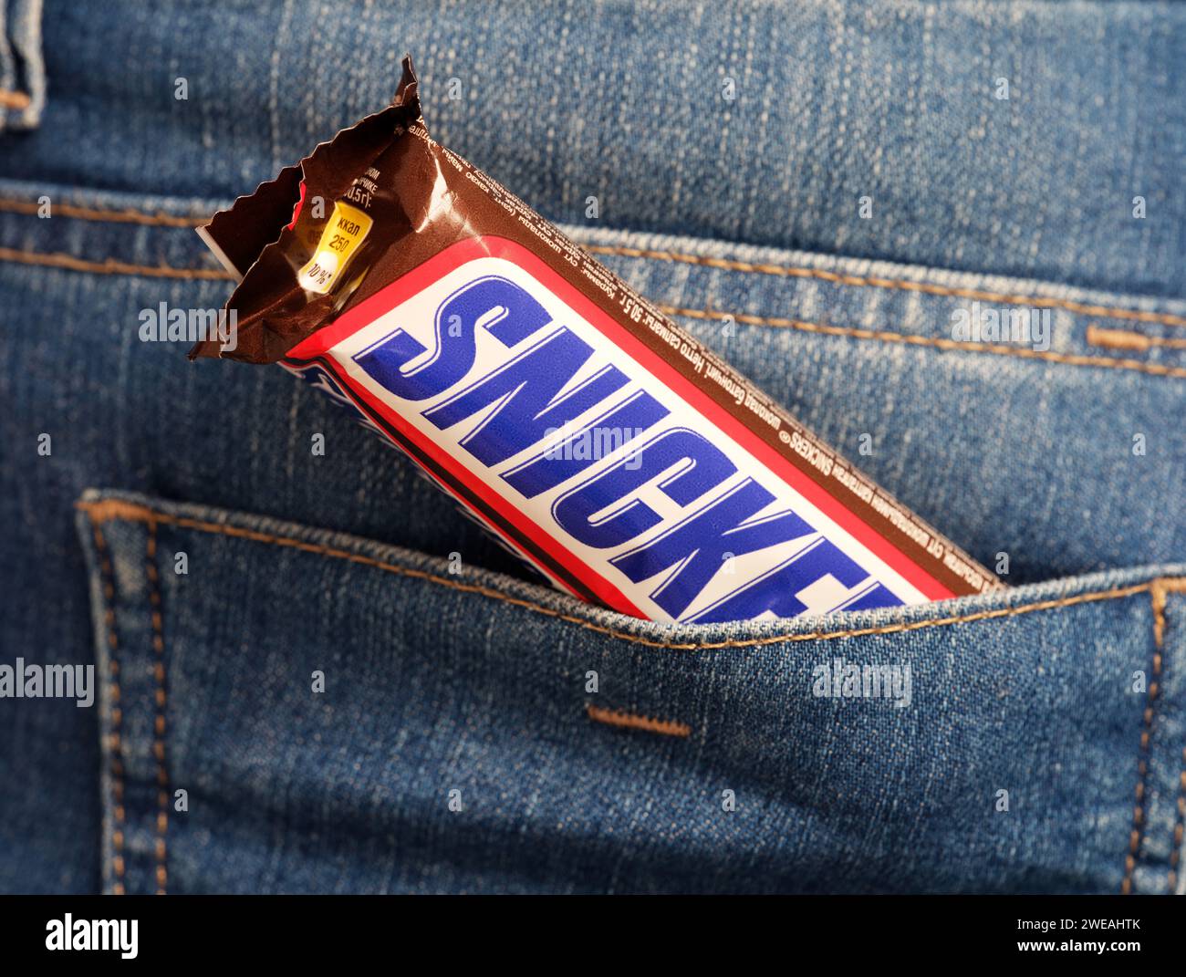 Tambov, Russian Federation - January 23, 2024 Snickers chocolate bar in ...