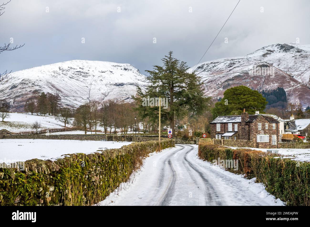 Walkers in the snow in and around Grasmere Village Cumbria North West ...