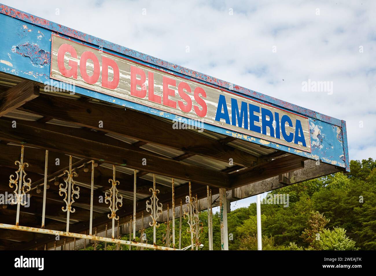 Weathered Patriotic Sign, Rustic Americana, Green Foliage Background ...