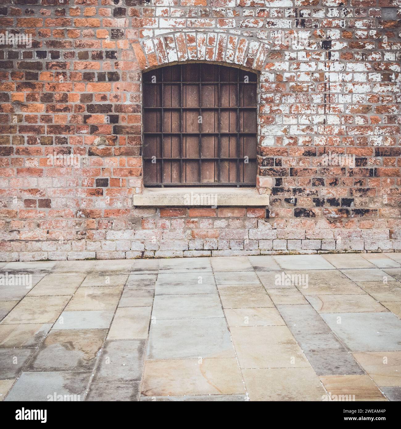 Victorian red brick warehouse barred windows at the historic docks at ...