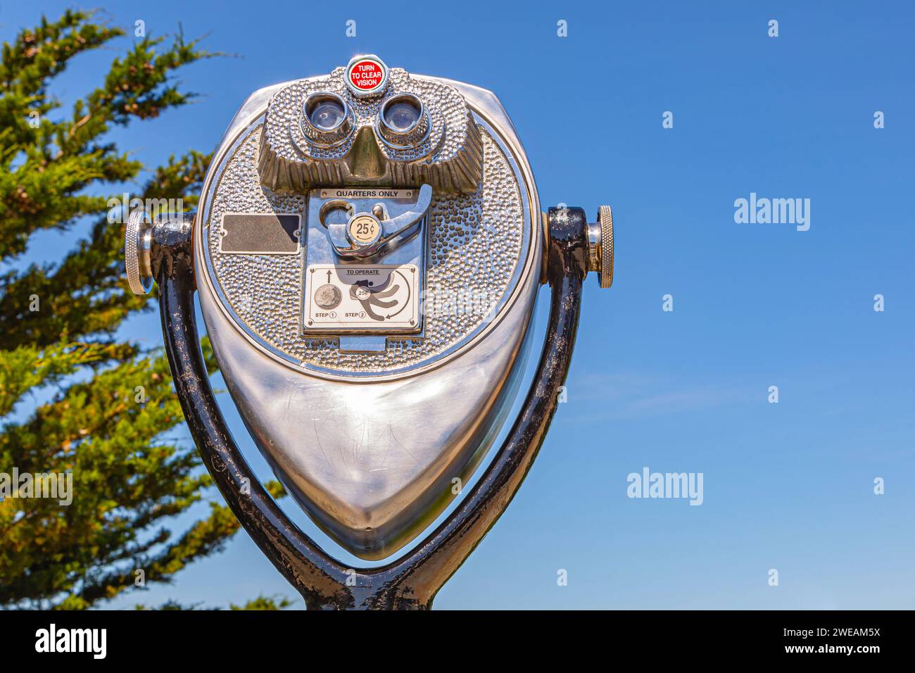 Binoculars Against Blue Sky. Coin operated binoculars popular on ...