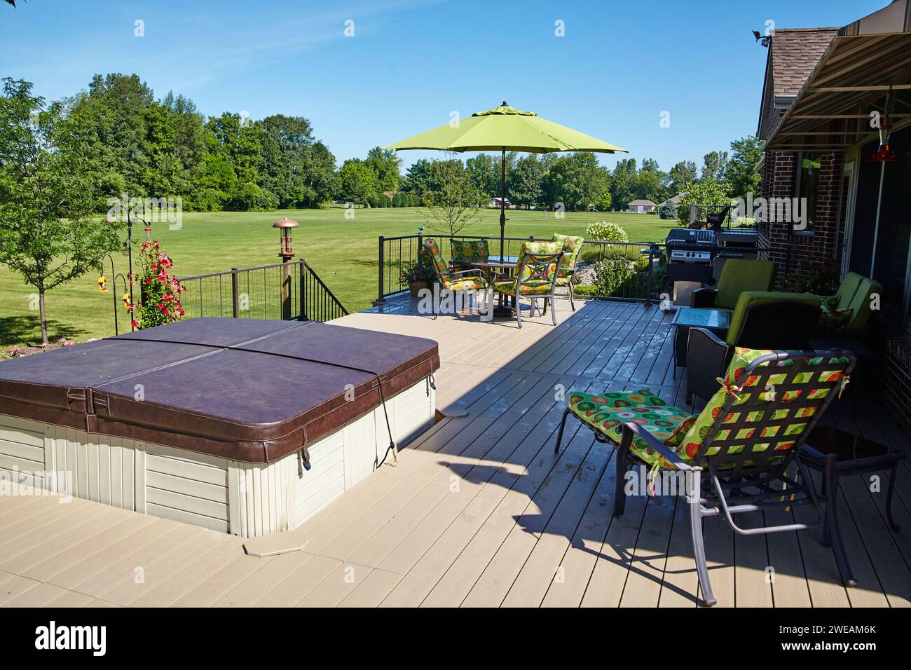 Suburban Backyard Deck with Patio Set and Grill Station Stock Photo - Alamy