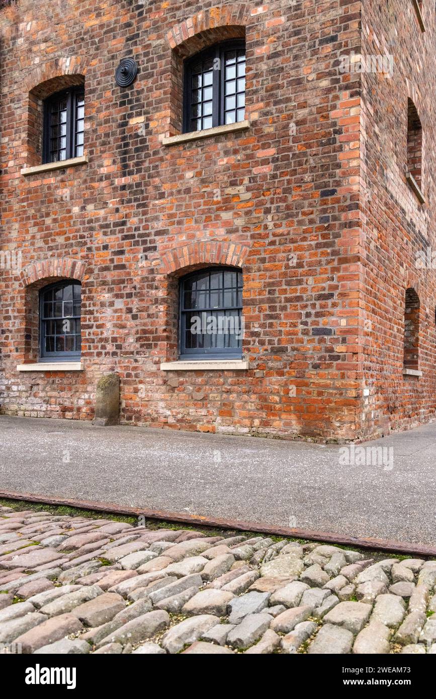 Victorian red brick warehouse barred windows at the historic docks at ...