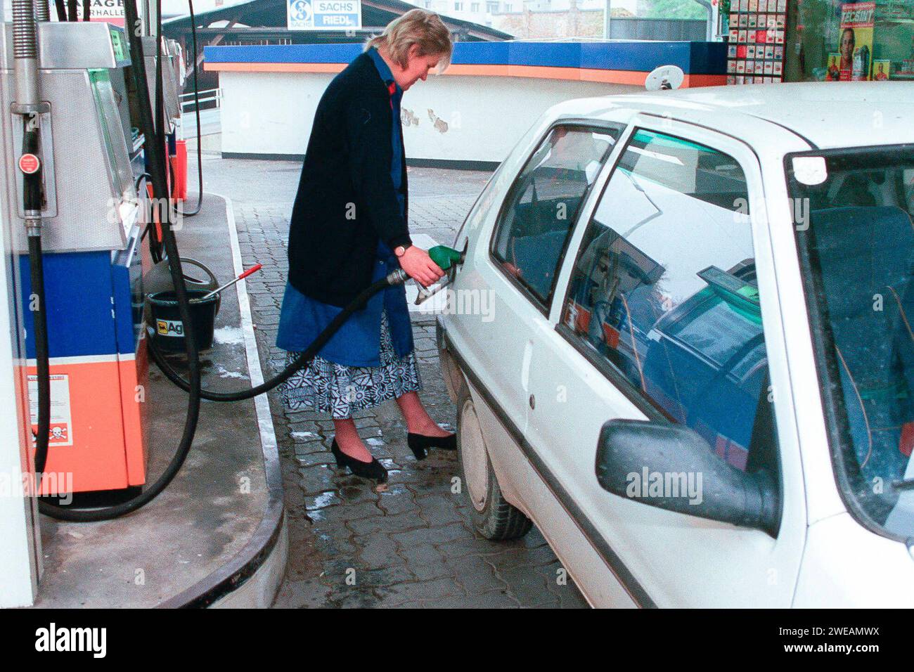 refueling a car with fuel for driving, transport and mobility refueling ...