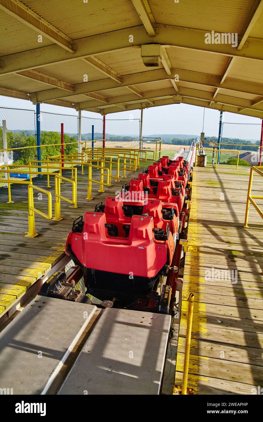 Vibrant Red Roller Coaster at Sunny Amusement Park, Front View ...
