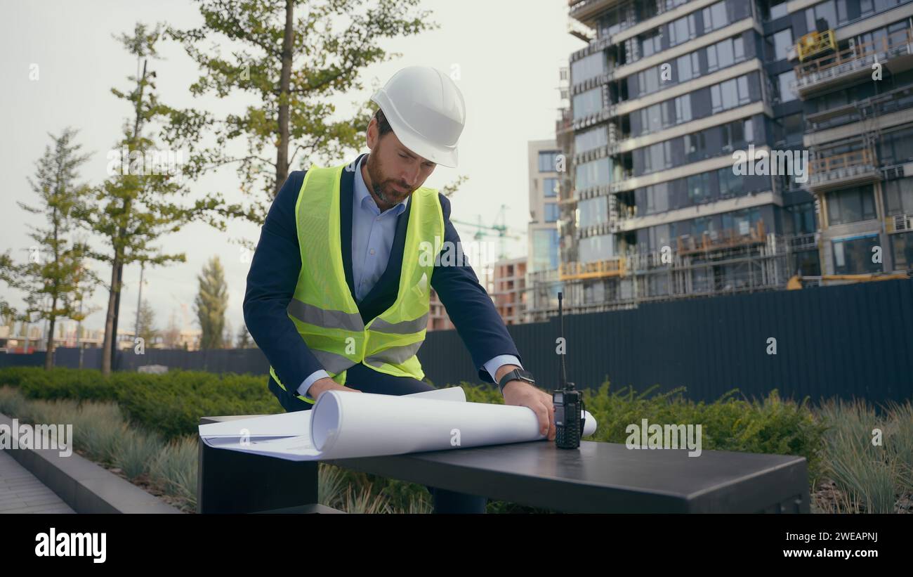 Pensive male architect thoughtful looking around think check urban ...