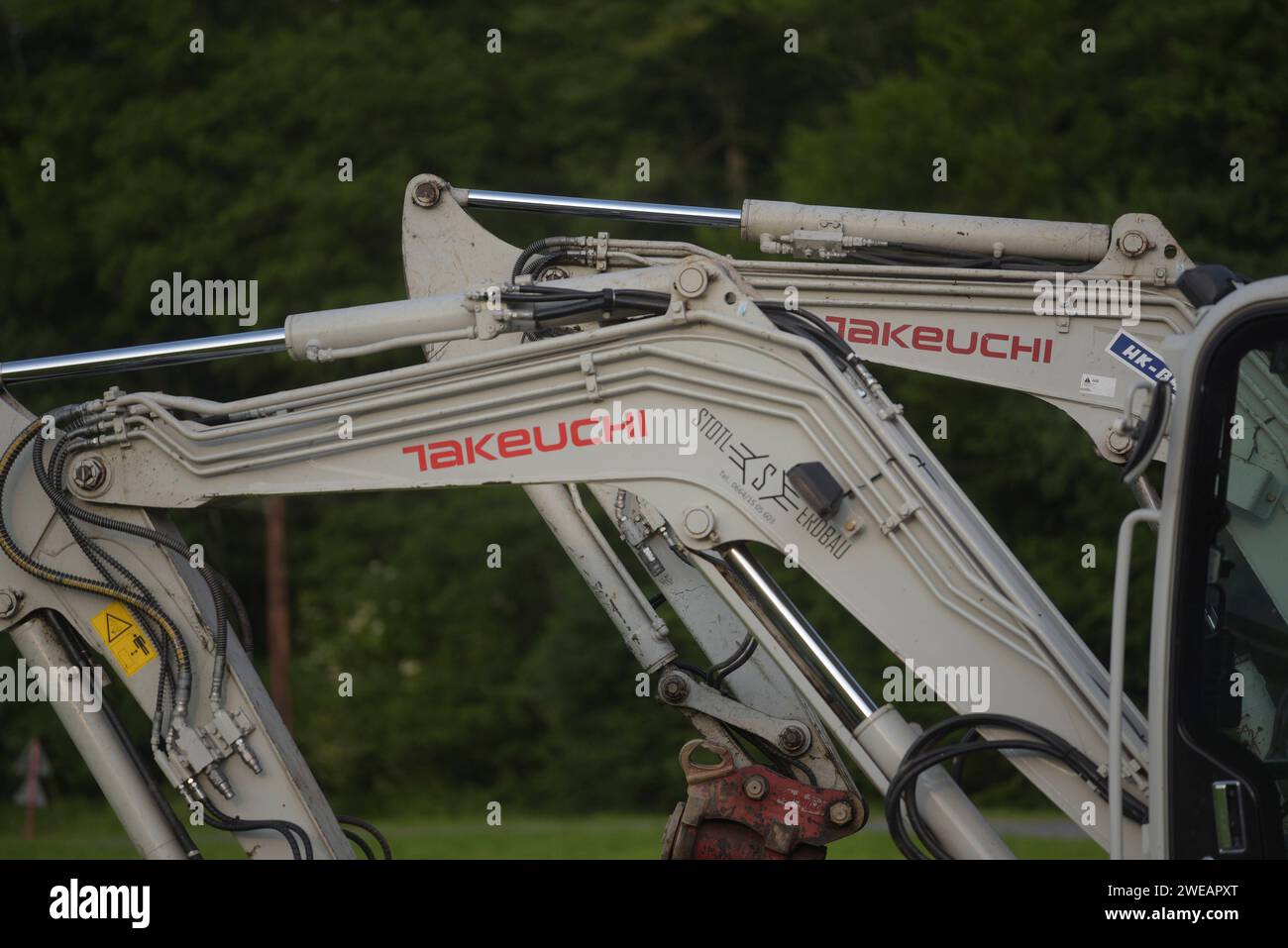 takeuchi Excavator at a construction site, heavy machinery for ...